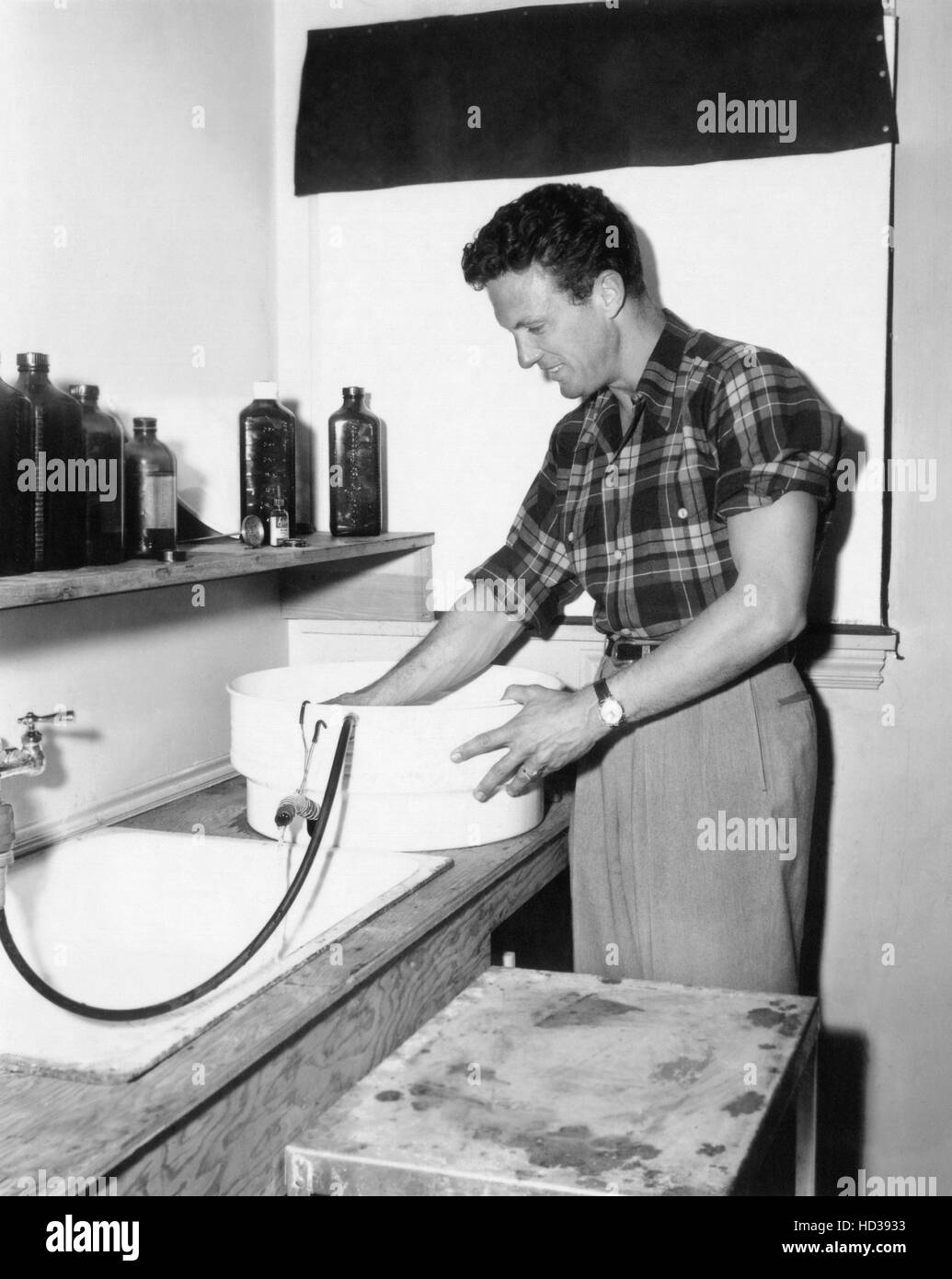 Robert Stack, developing photos at home, 1954 Stock Photo - Alamy
