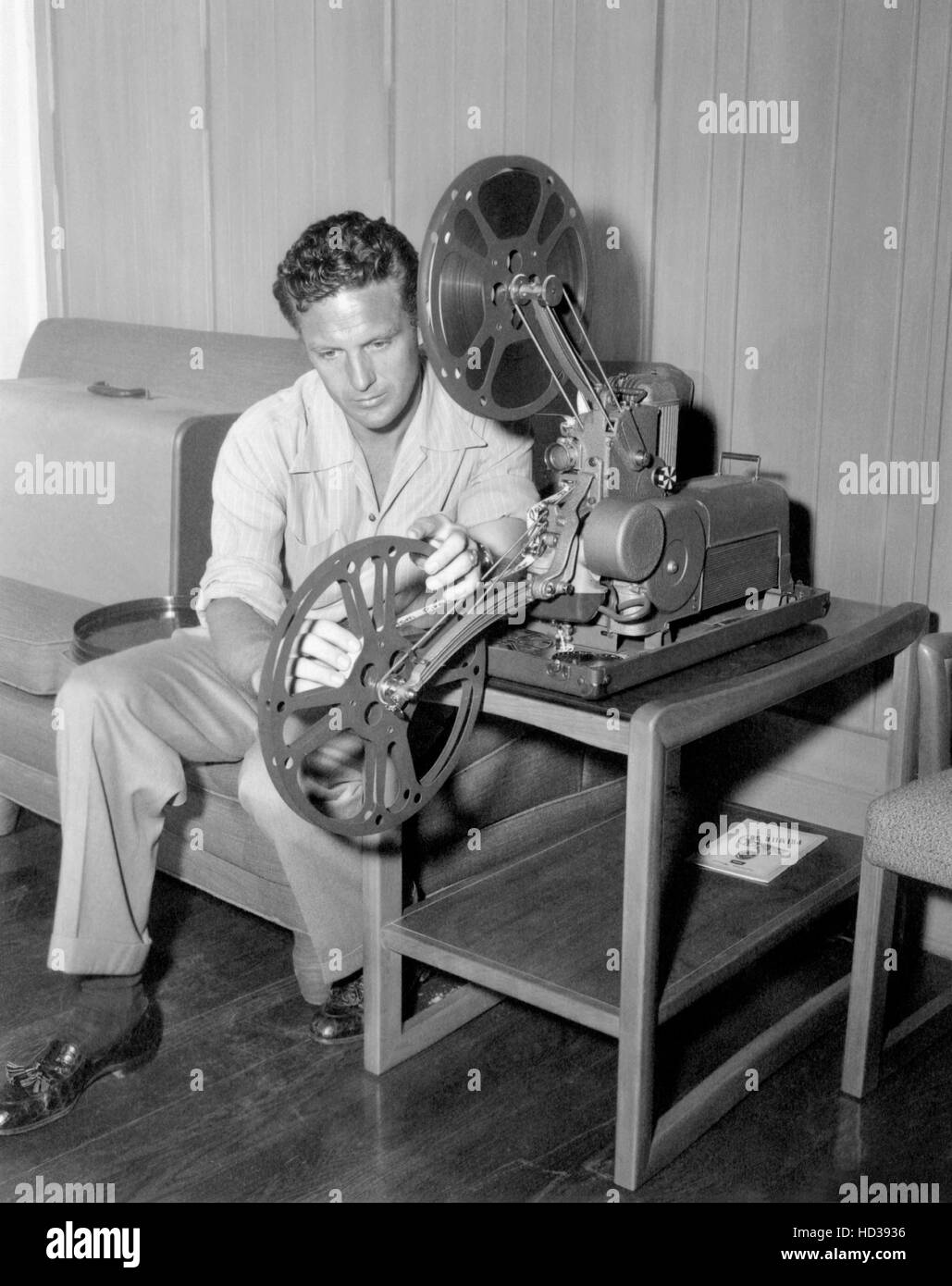 Robert Stack, with his movie projector, at home, 1954 Stock Photo - Alamy