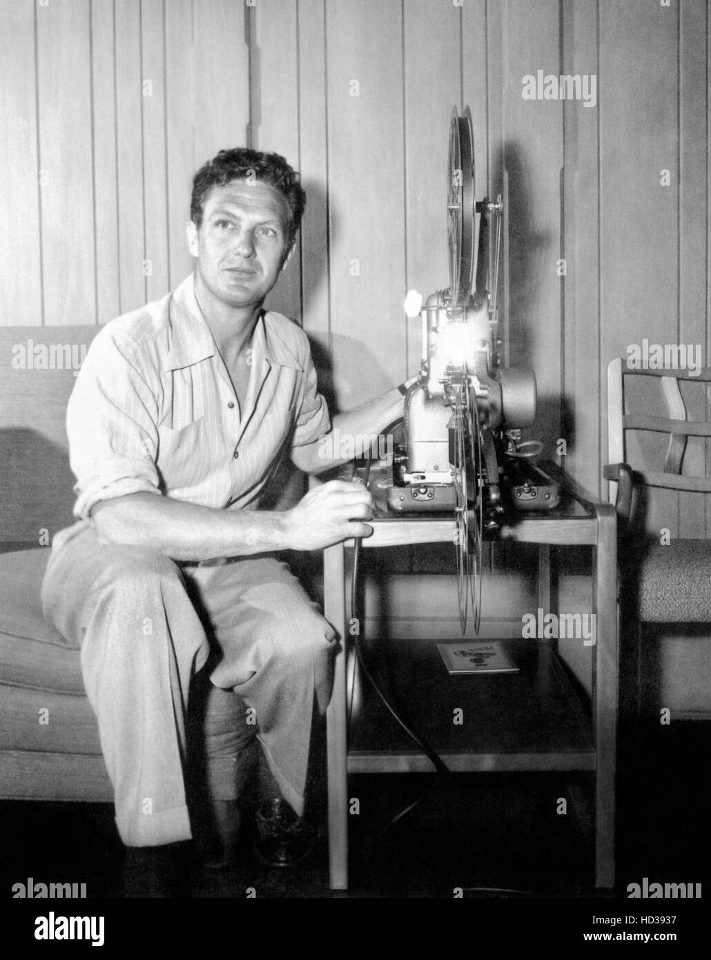 Robert Stack, with his movie projector, at home, 1954 Stock Photo - Alamy
