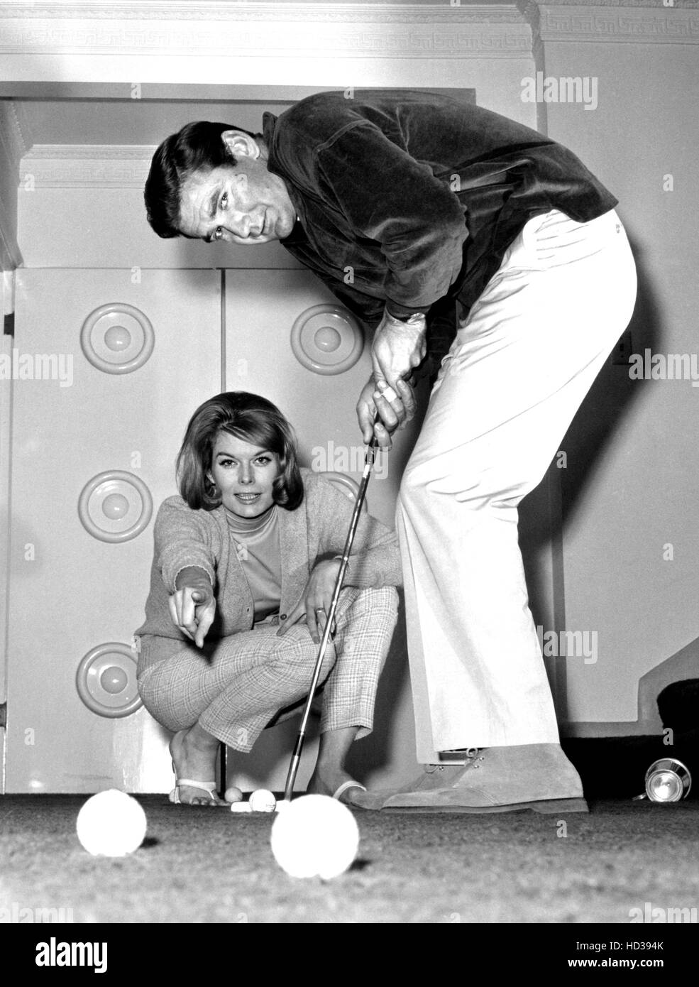 Rod Taylor (right) and wife, Mary Hilem, play golf in the hall of their ...