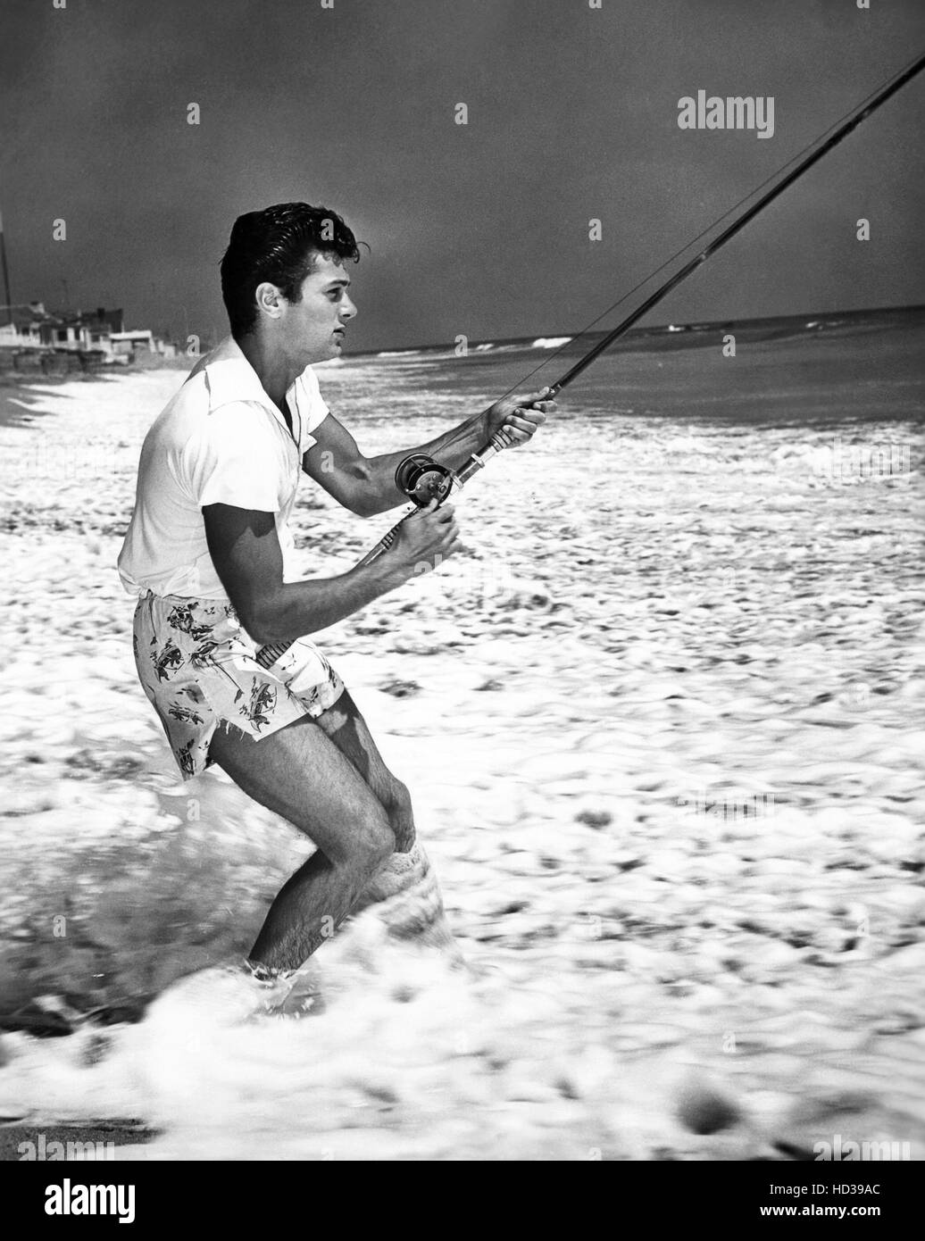 Tony Curtis fishing in ocean, 1949 Stock Photo - Alamy