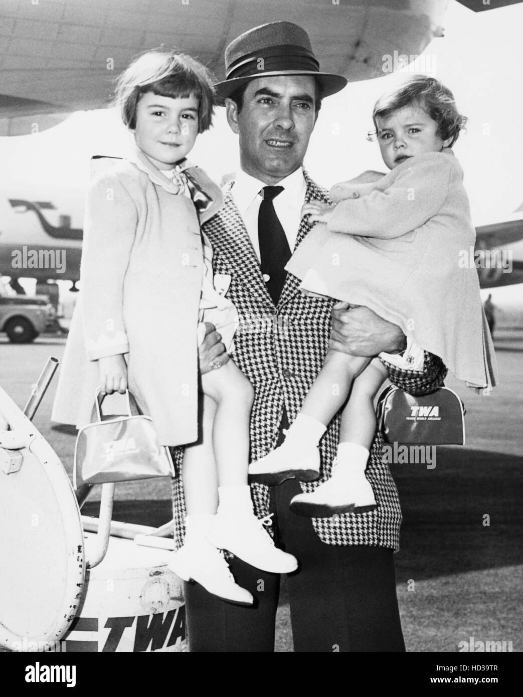 Tyrone Power arriving in New York holding daughters Romina Power (left ...