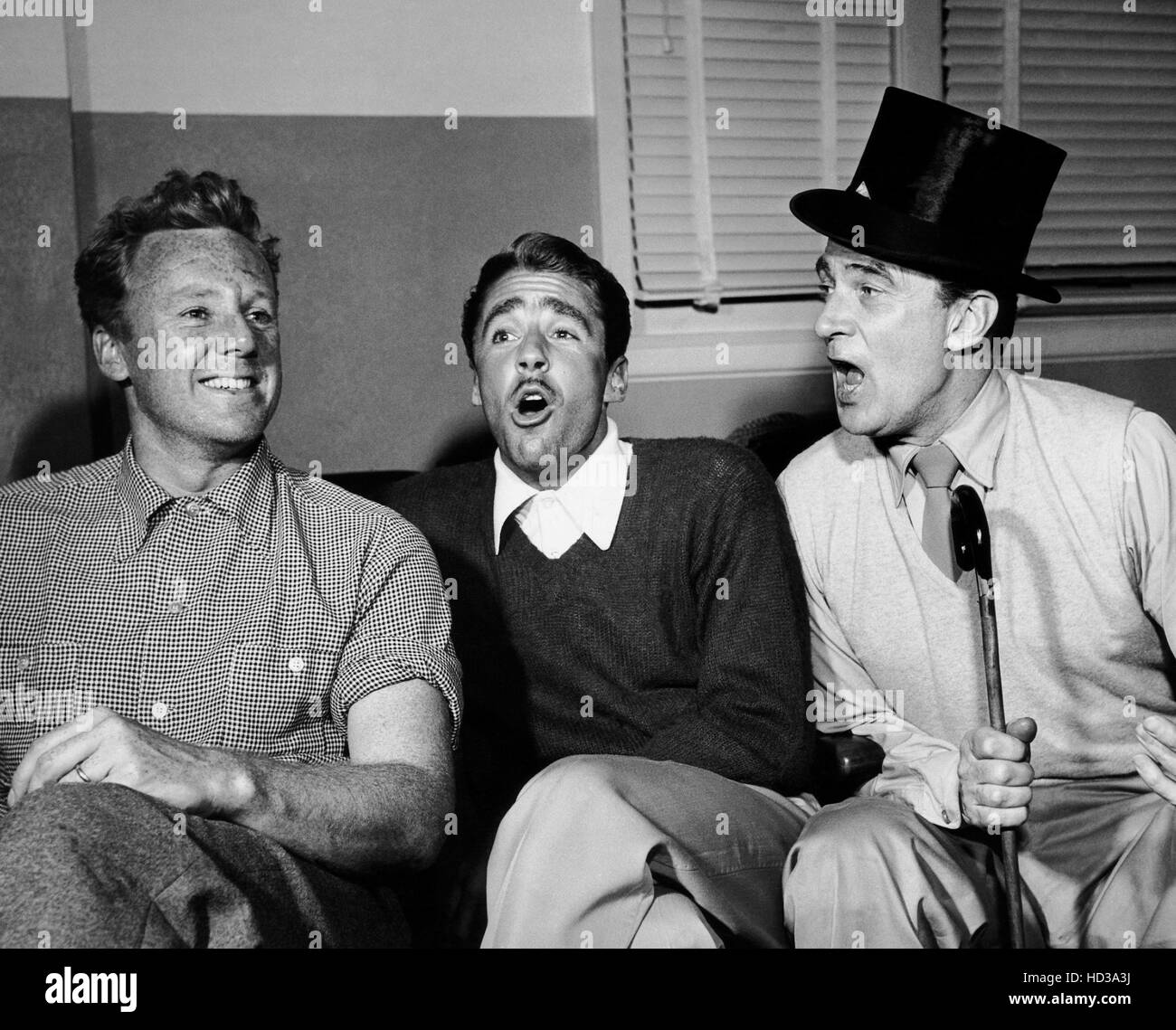 From left, Van Johnson, Peter Lawford, Walter Pidgeon, clowning around, ca. early 1950s Stock ...