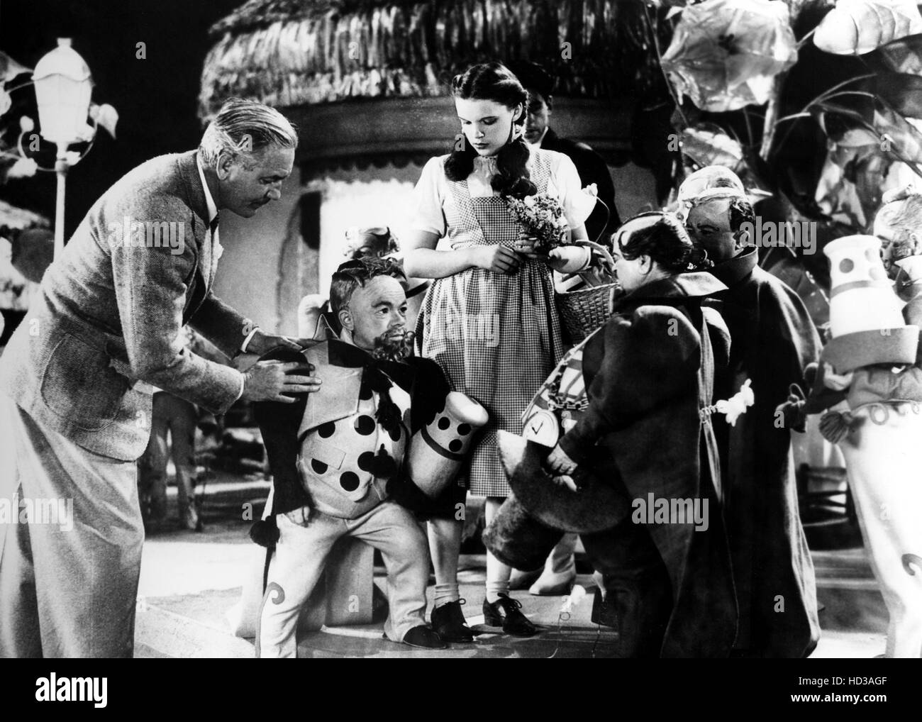 THE WIZARD OF OZ, Victor Fleming directs Munchkin actor as Judy Garland ...