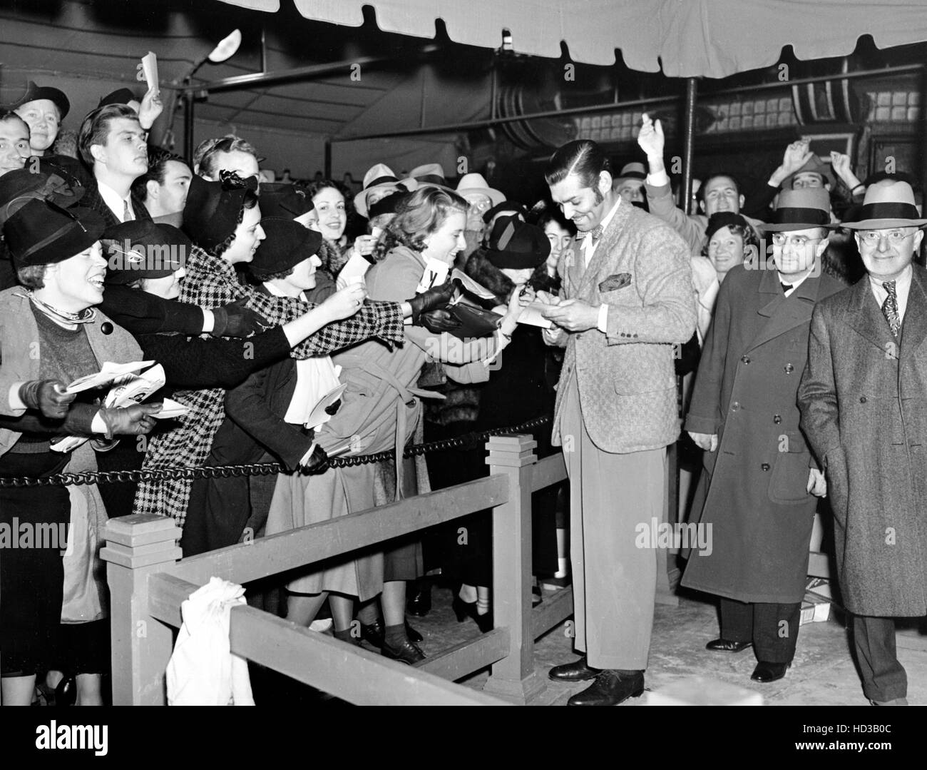 Clark Gable signing autographs for fans, 1936 Stock Photo - Alamy