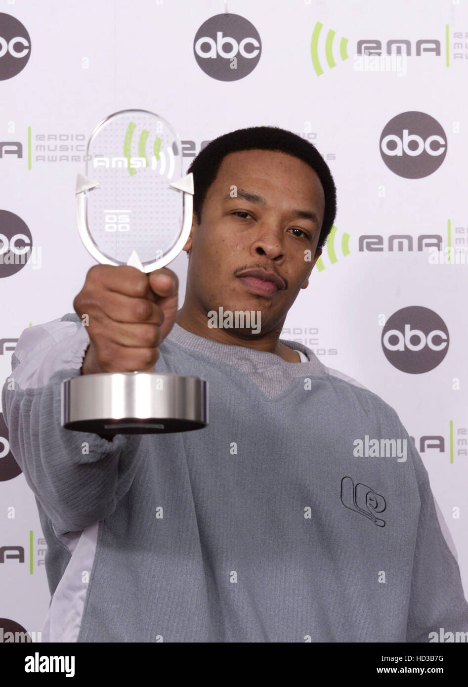 Dr. Dre (aka Andre Young) holding up his Legend Award, backstage at the 2000 Radio Music Awards ...