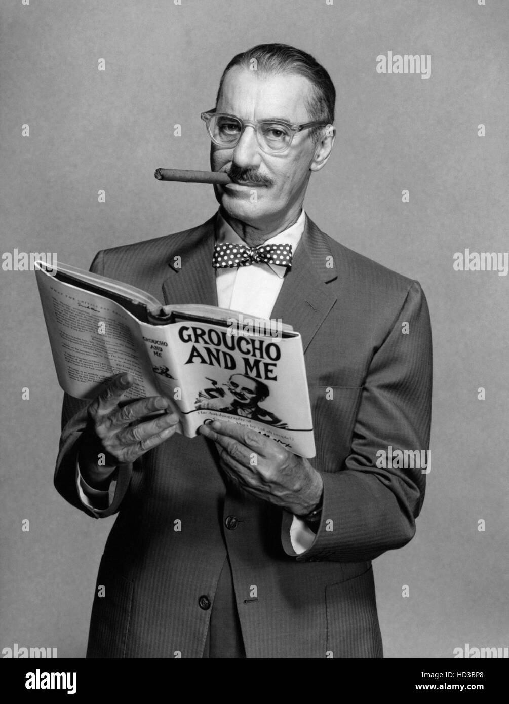 Groucho Marx, posing with his memoir, 'Groucho and Me', ca. 1959 Stock ...