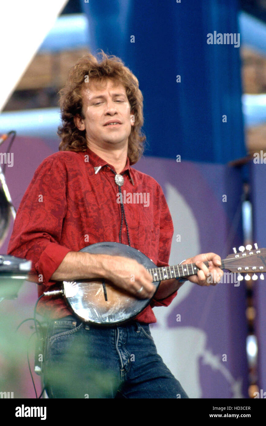 John Lilley performing with the Hooters at the concert for Amnesty ...