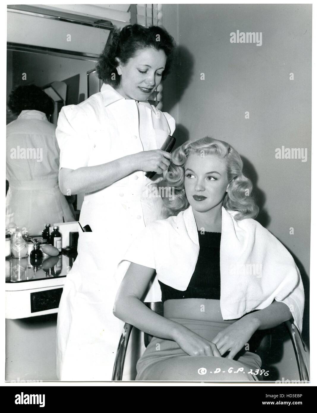 Columbia hairstylist Helen Hunt working on starlet Marilyn Monroe, ca ...
