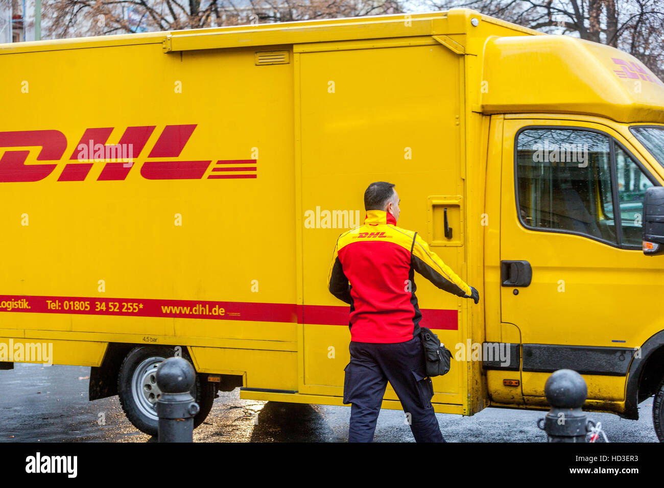 DHL van delivery Berlin, Germany Europe DHL man rear view back Stock ...