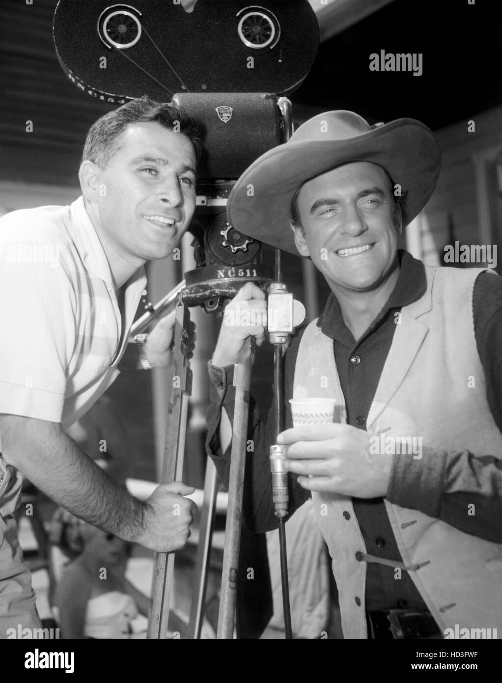 GUNSMOKE, James Arness (right) with crew member on-set, 1955-75 Stock ...