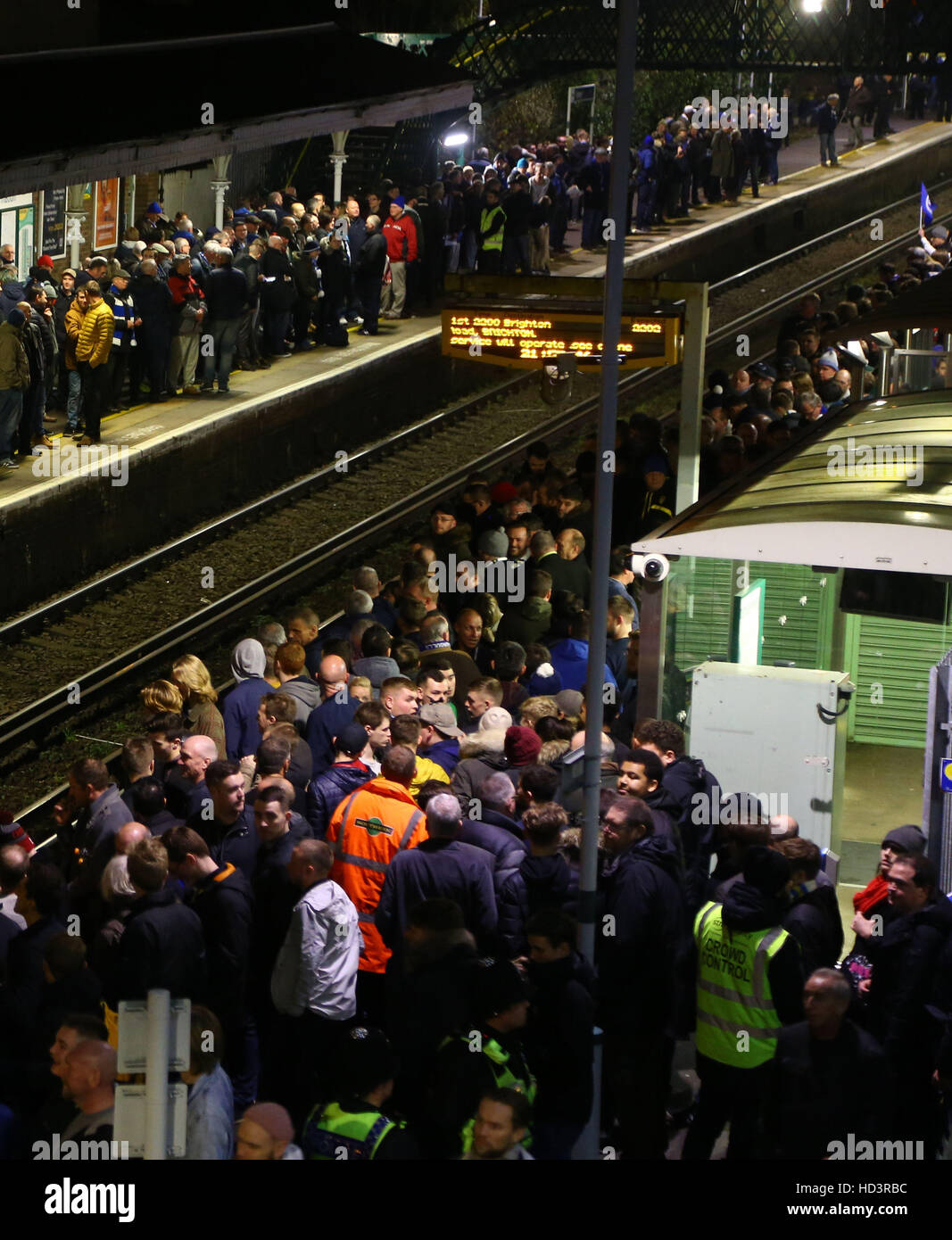 football supporters wait for a Southern train at Falmer railway station ...