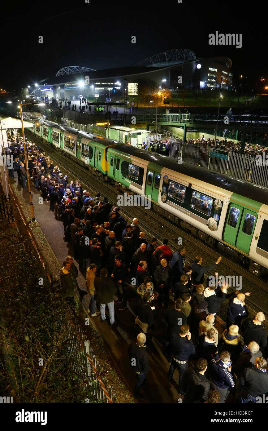 Football supporters wait for a Southern train at Falmer railway station ...