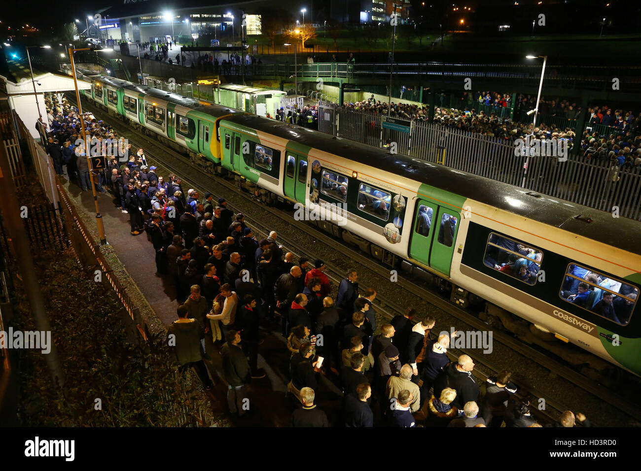 Football supporters wait for a Southern train at Falmer railway station ...