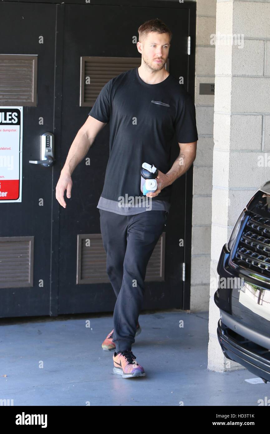 Calvin Harris post-workout carries an empty protein shake bottle and ...