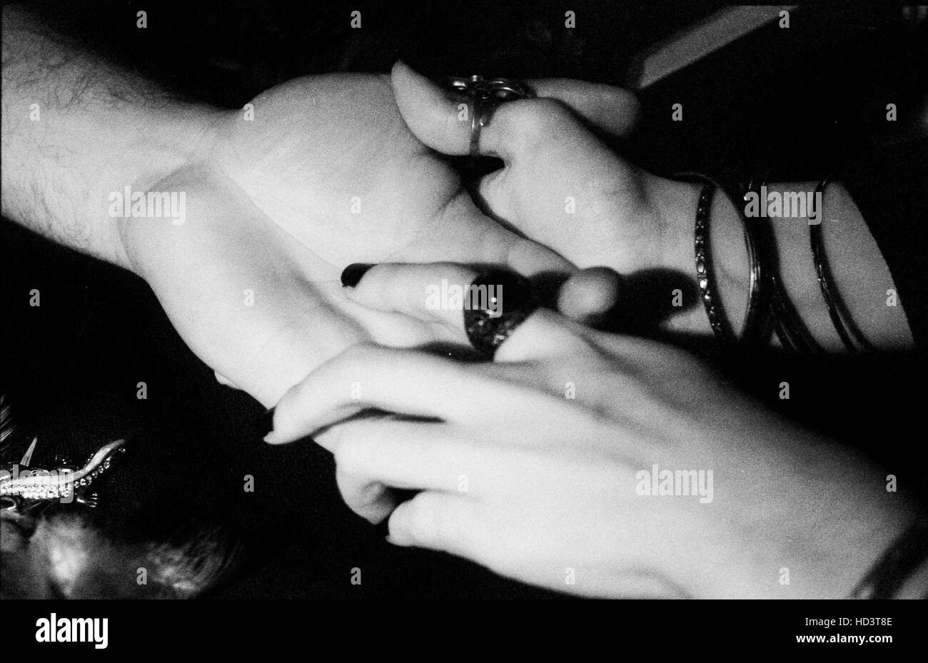 Palmistry, detail of woman reading a man's hand Stock Photo - Alamy