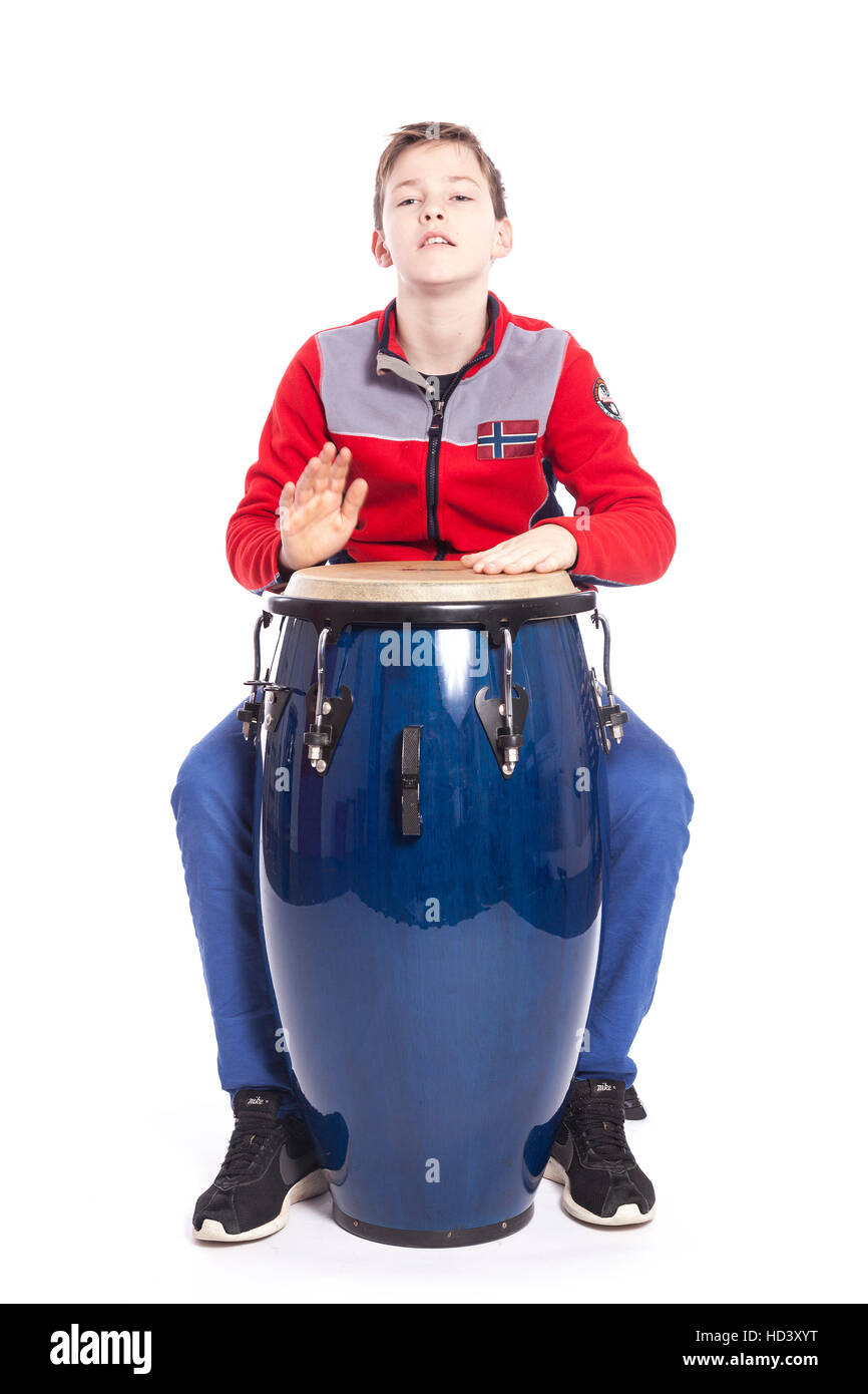 teenage caucasian plays the conga in studio with white background Stock ...