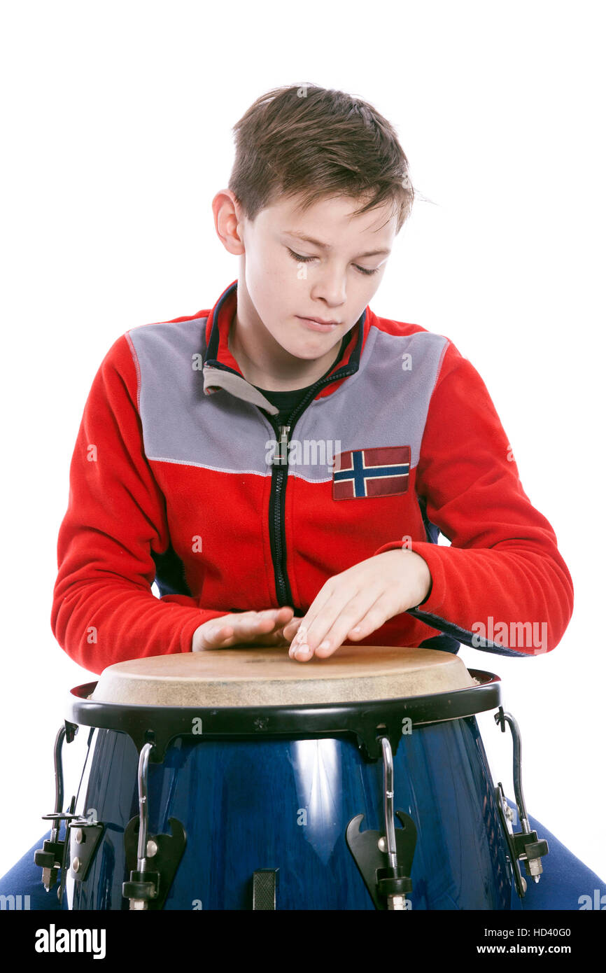 teenage caucasian plays the conga in studio with white background Stock ...