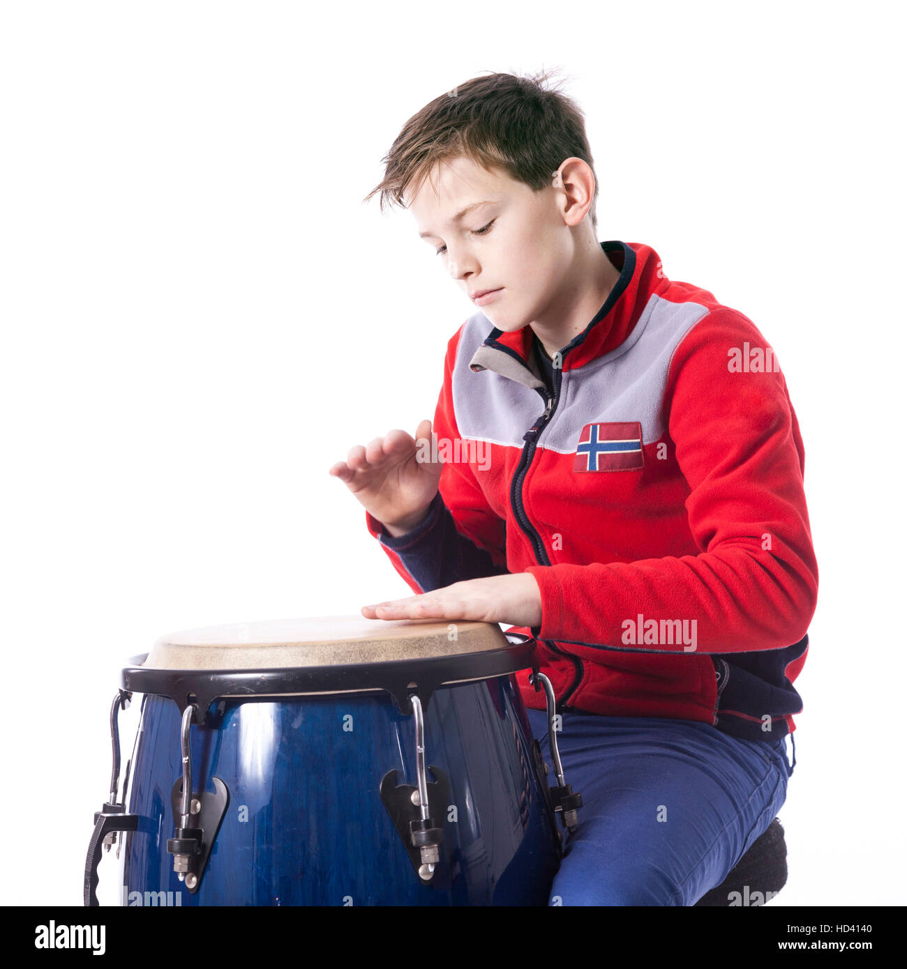 teenage caucasian plays the conga in studio with white background Stock ...