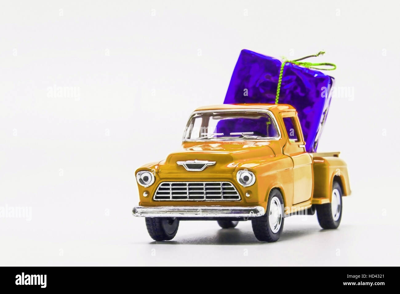 yellow retro car pickup violet gift box isolated Stock Photo - Alamy