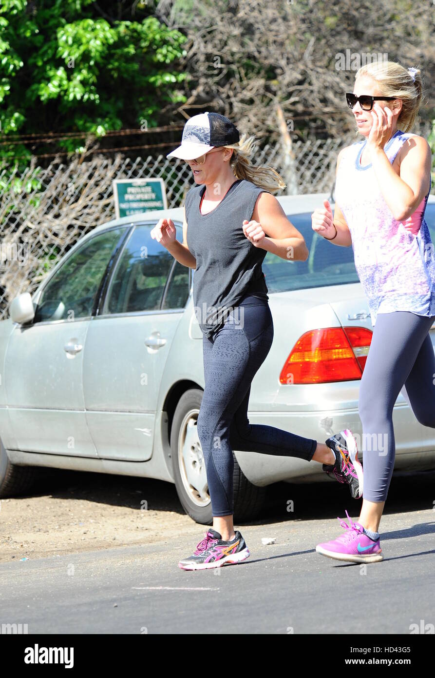 Reese Witherspoon jogging with a friend Featuring: Reese Witherspoon ...