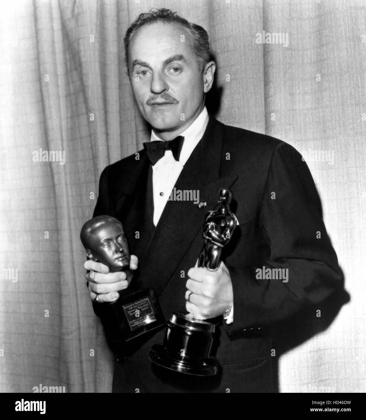 1950: DARRYL F. ZANUCK [Best Picture, ALL ABOUT EVE] brandishes both ...