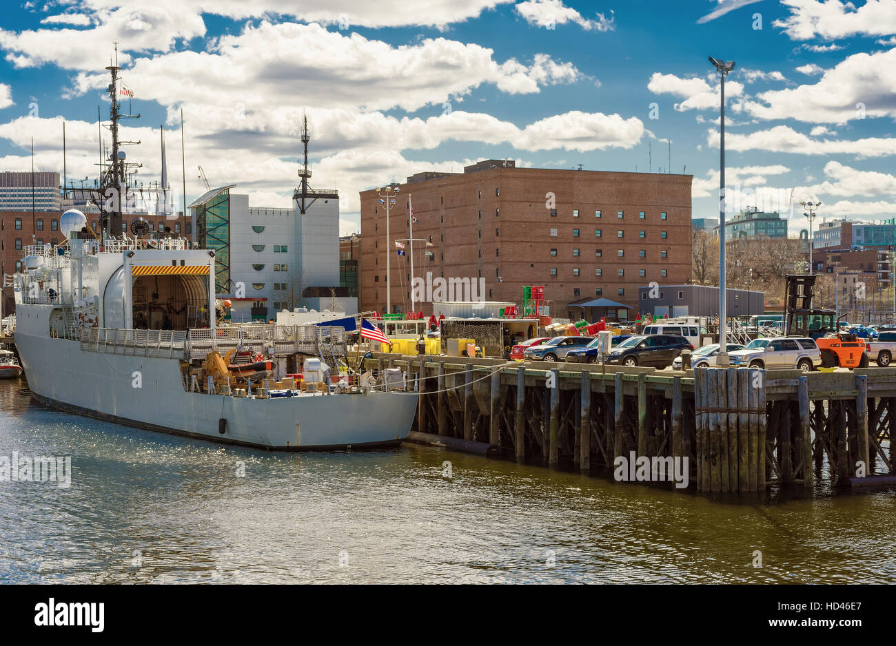 Moored ship at the pier in Boston, USA. The city is located near many ...