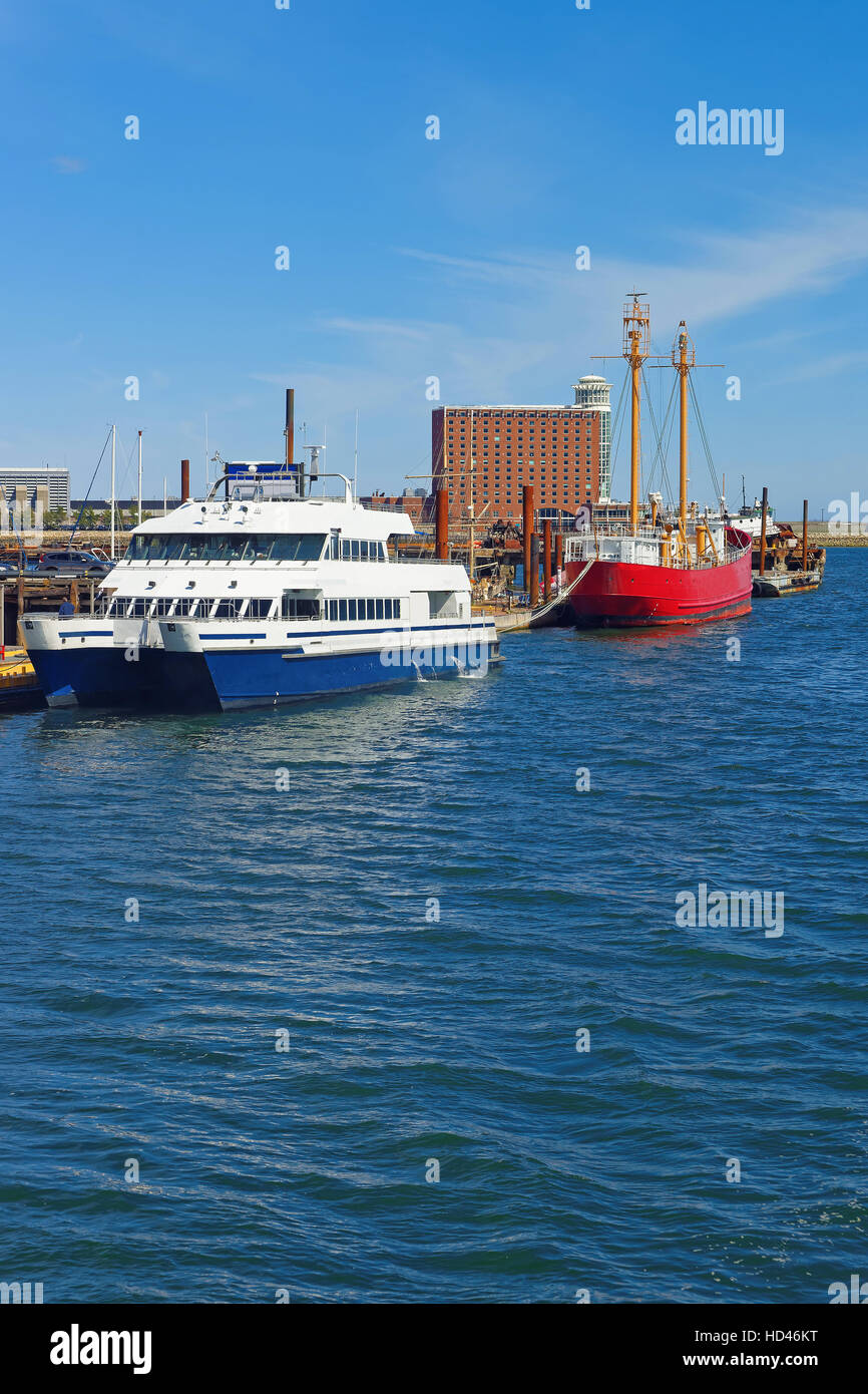 Moored ships and boats near the pier in Boston, USA. The Port of Boston ...