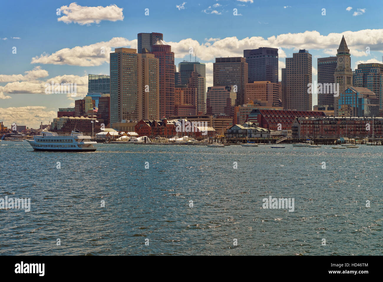 Water transport traveling across the river with the skyline of the city ...
