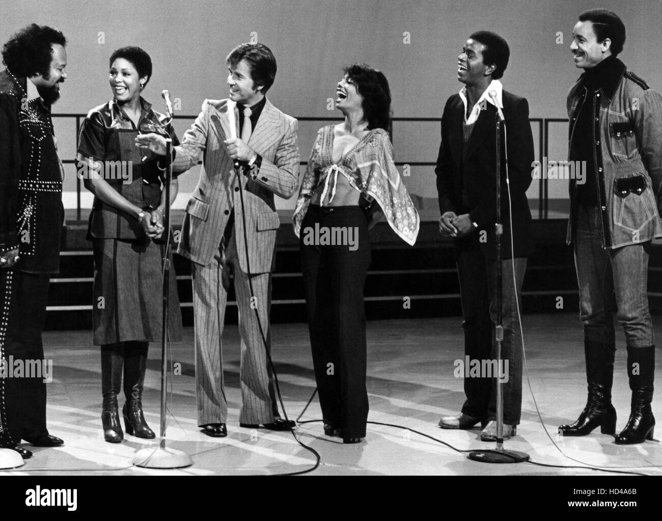 AMERICAN BANDSTAND, Dick Clark (3rd from left) with musical group the ...
