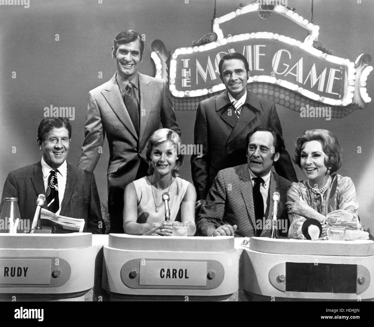 THE MOVIE GAME, (back row, l to r): host Sonny Fox, Army Archerd ...