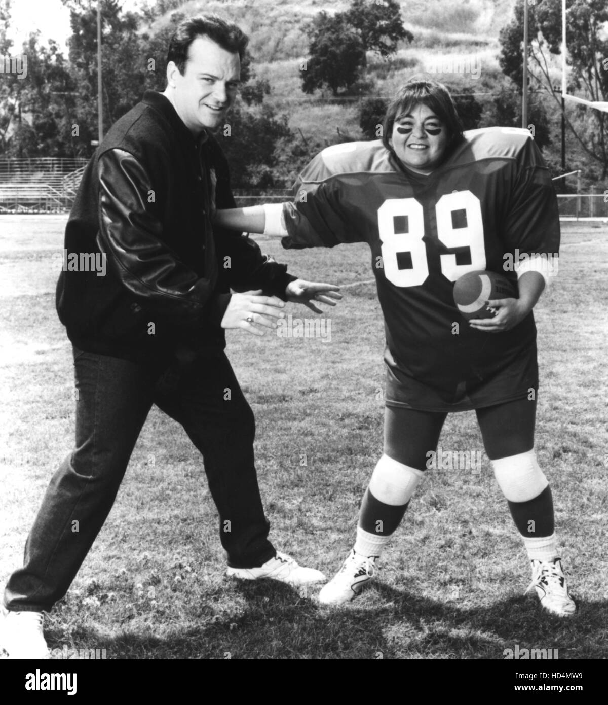 BACKFIELD IN MOTION, Tom Arnold, Roseanne, 1991 Stock Photo - Alamy