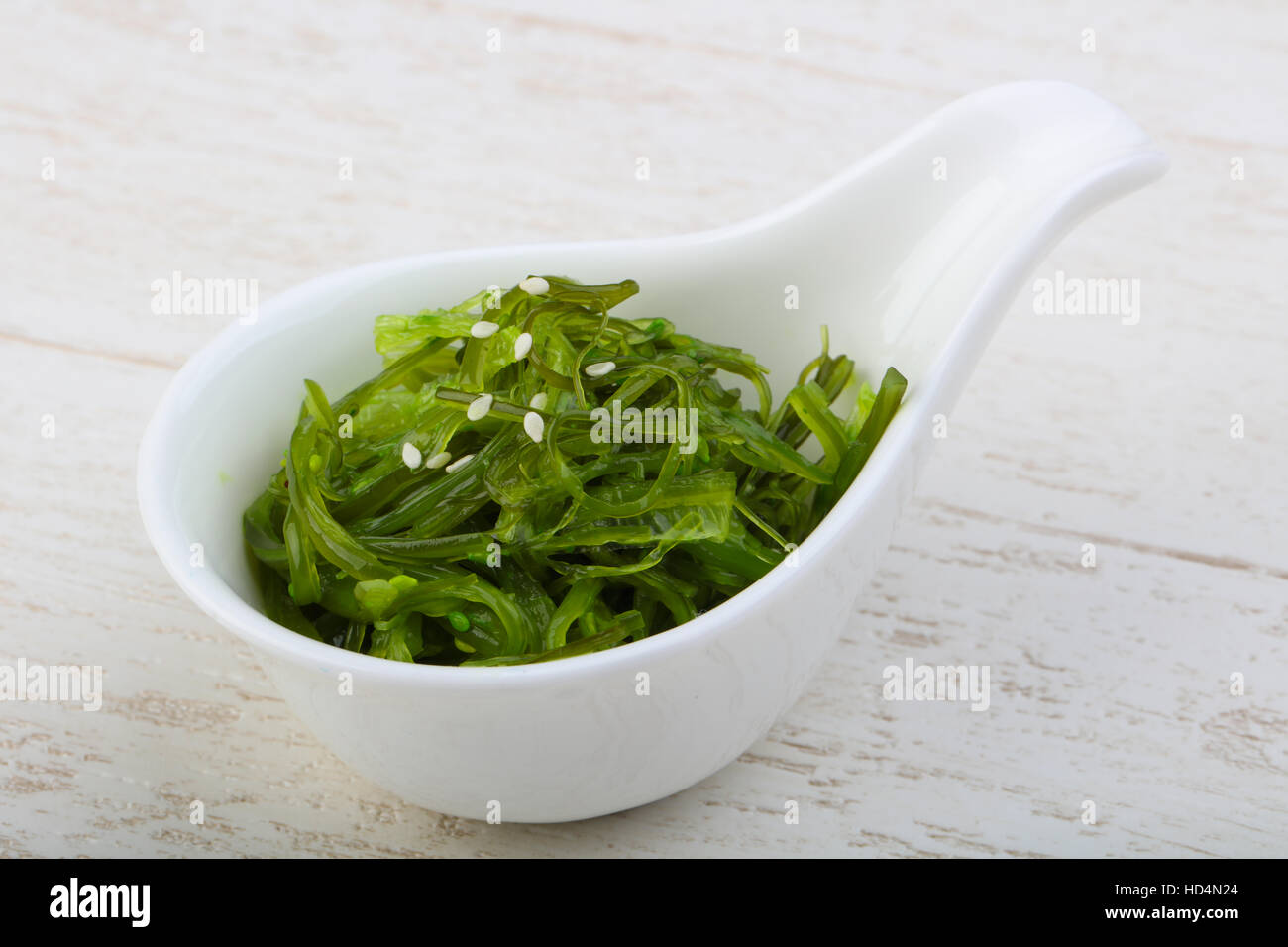 Chuka with sesame seeds in the bowl on wood background Stock Photo - Alamy
