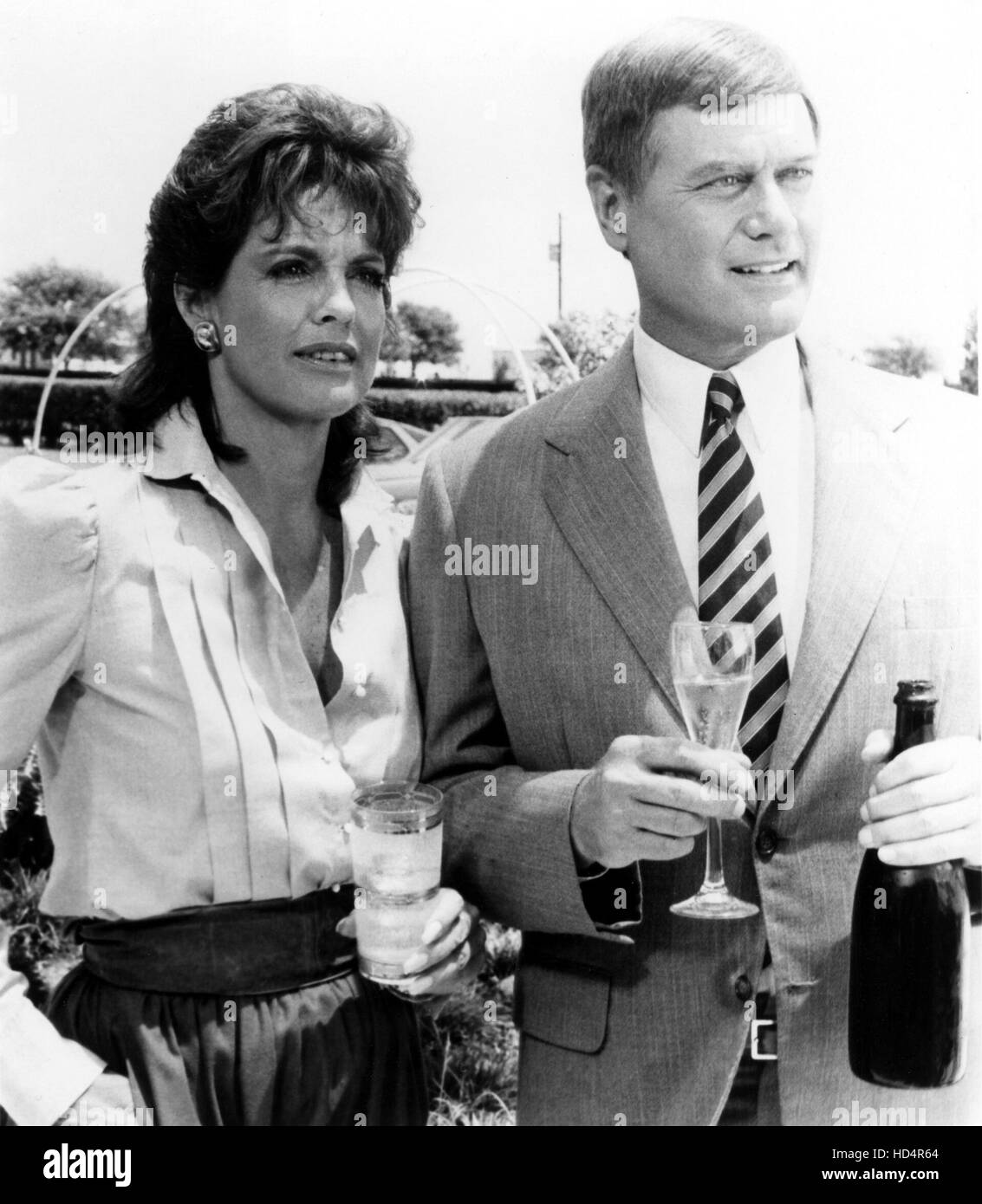 DALLAS, Linda Gray, Larry Hagman, 1978-1991 Champagne toast Stock Photo ...
