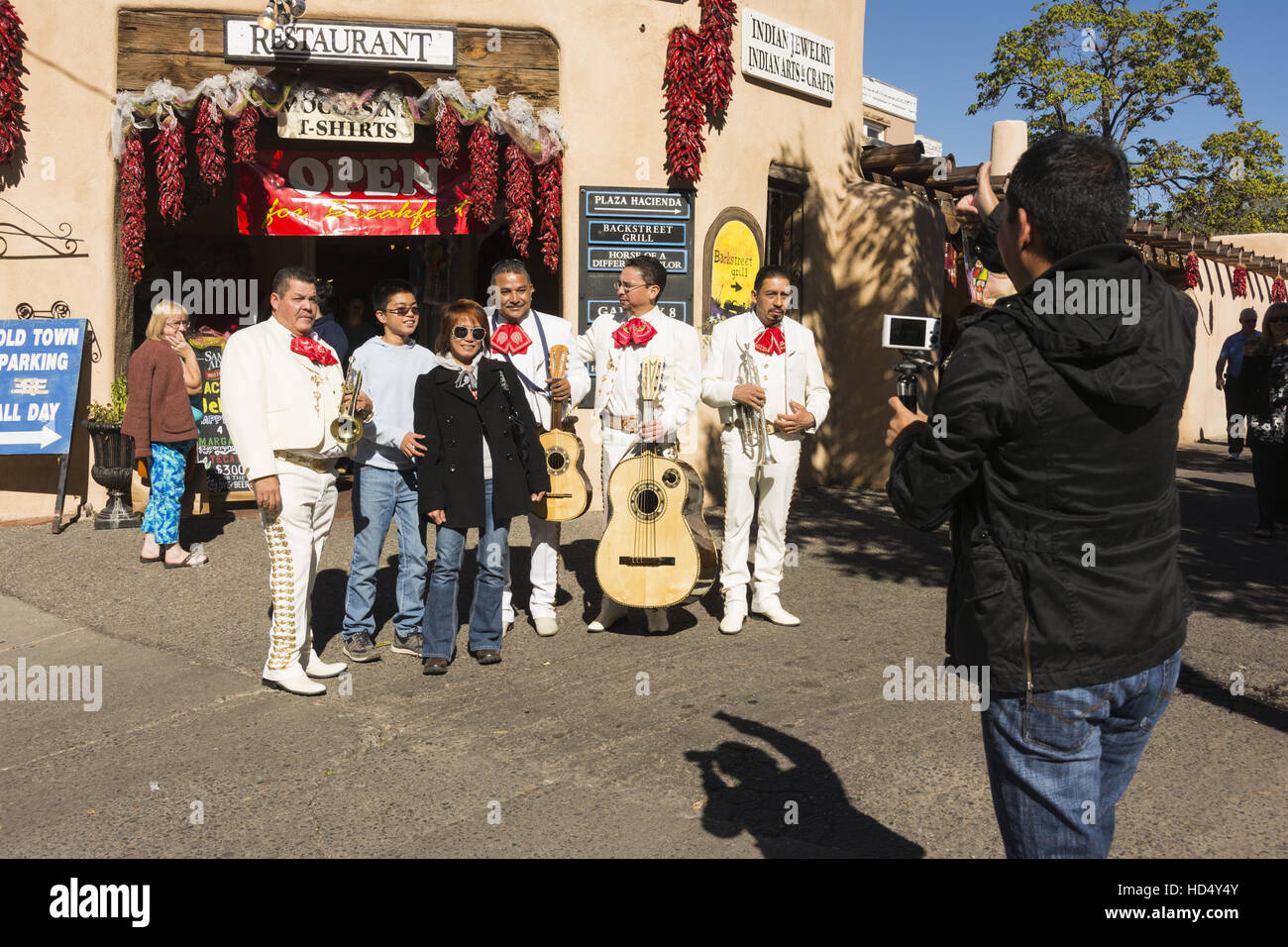 New Mexico, Albuquerque, Old Town, mariachi musicians with tourist ...