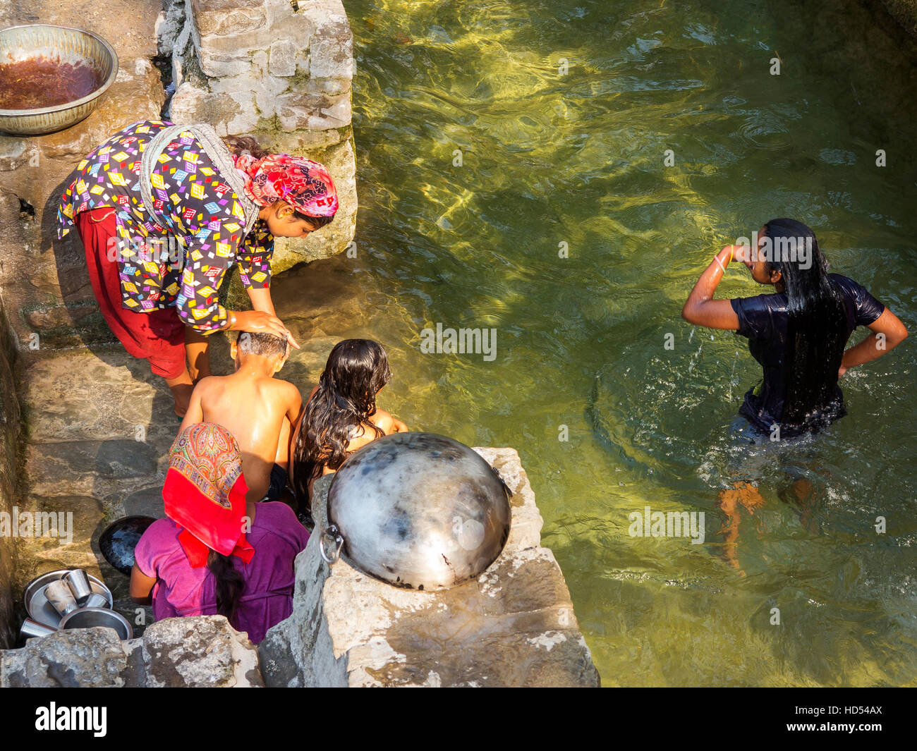 Indian people washing and bathing at Boar Canal in the heat of the day ...