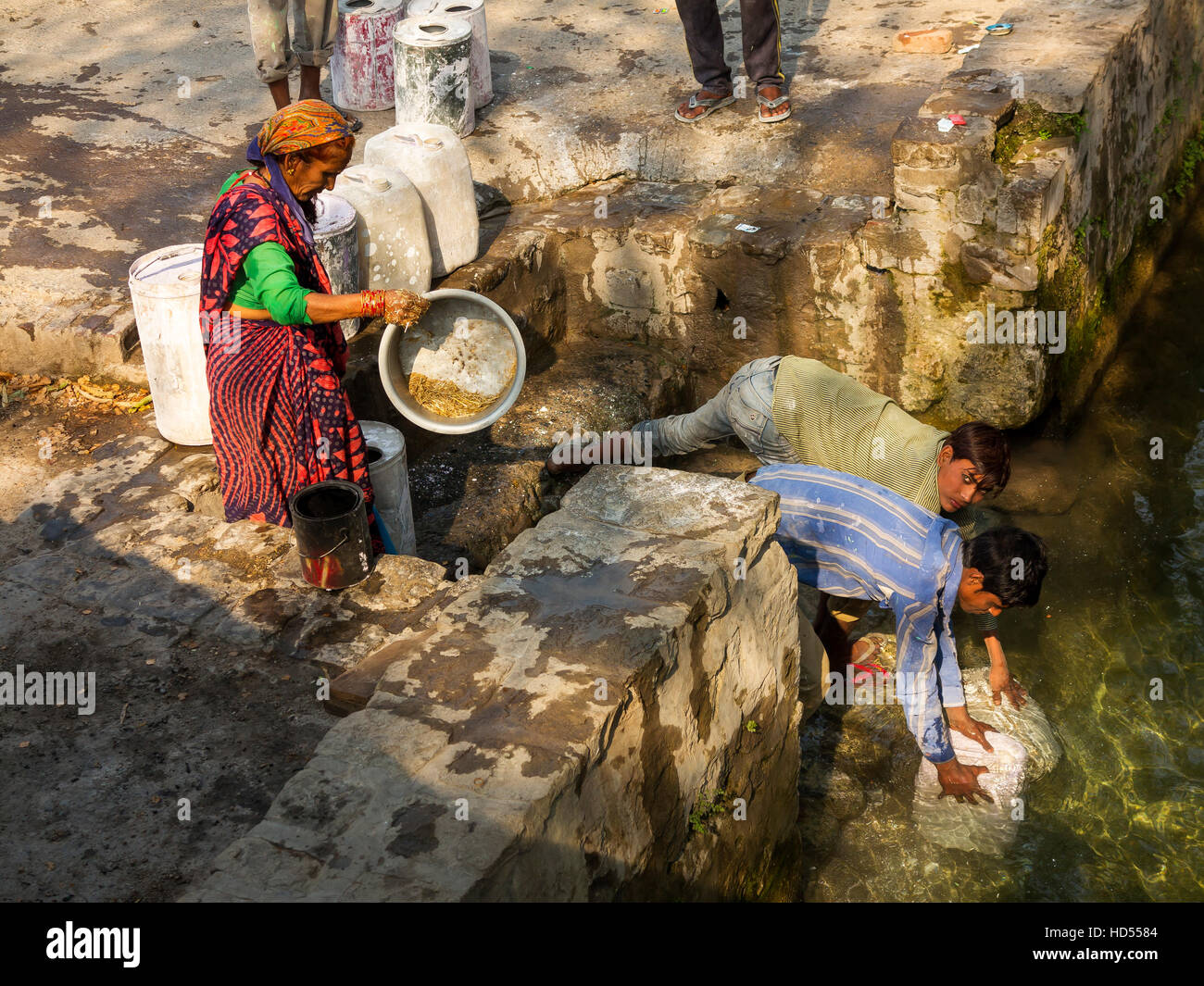 Indian boys fetching water at Boar Canal in the heat of the day at ...