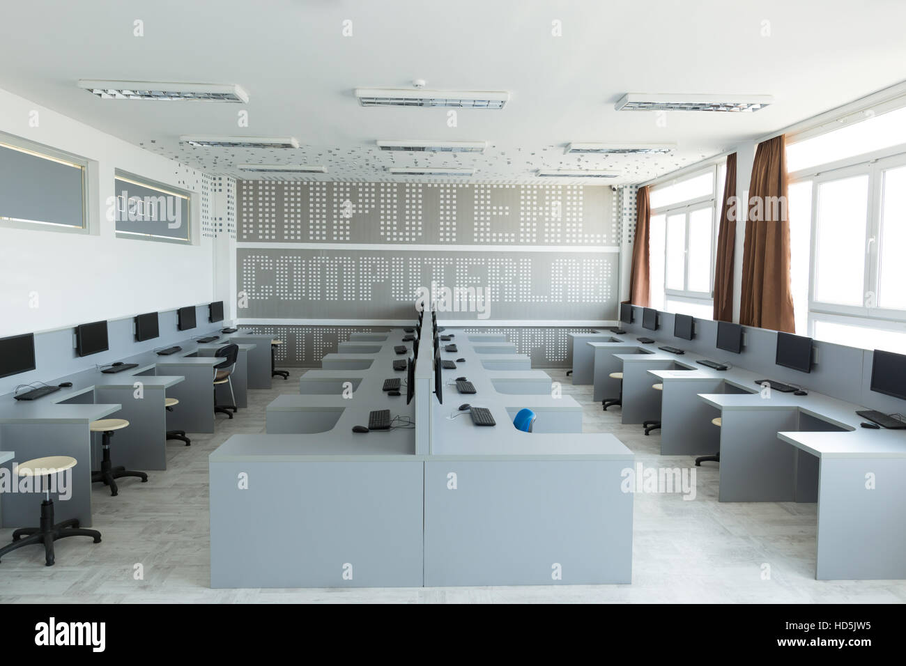Workplace room with computers in row Stock Photo - Alamy