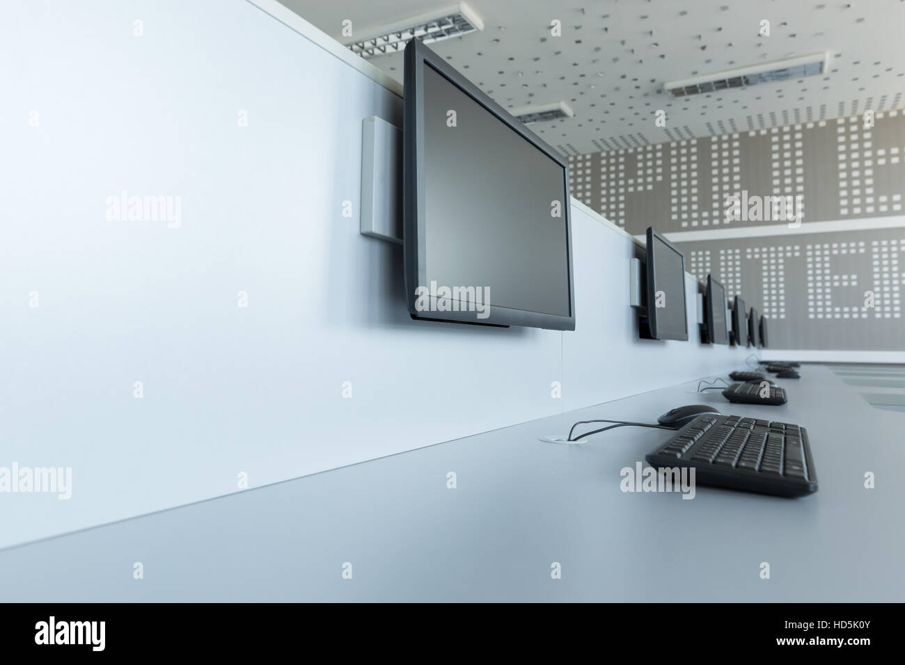 Workplace room with computers in row Stock Photo - Alamy