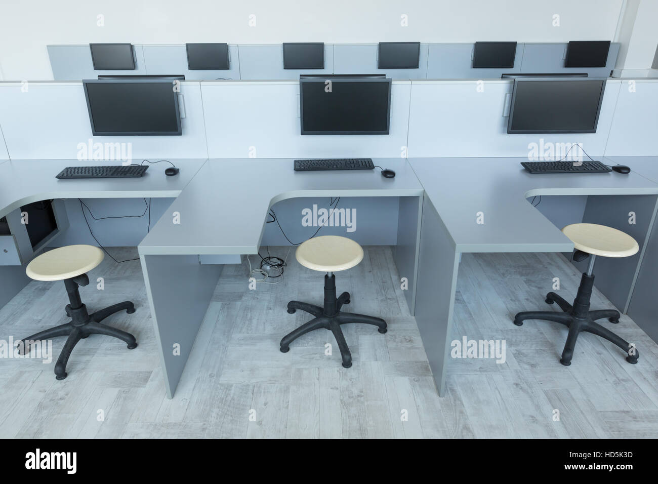 Workplace room with computers in row Stock Photo - Alamy