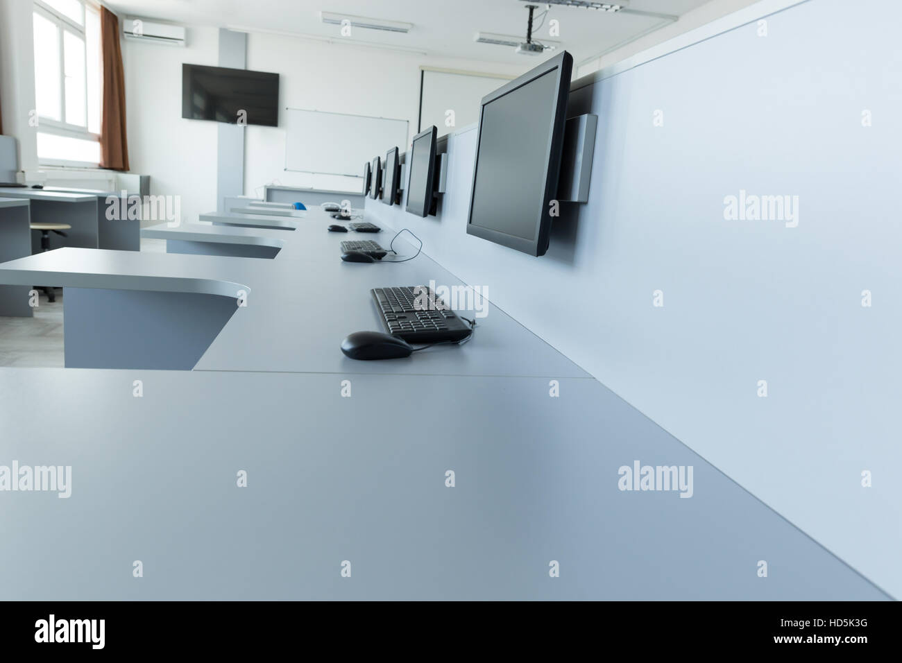 Workplace room with computers in row Stock Photo - Alamy