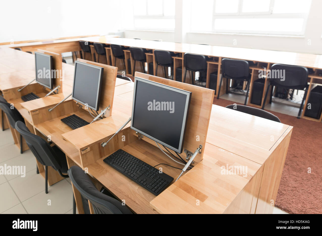 Workplace room with computers in row Stock Photo - Alamy