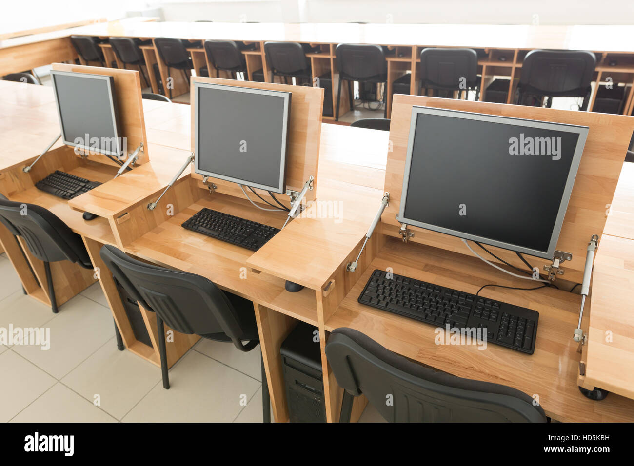 Workplace room with computers in row Stock Photo - Alamy