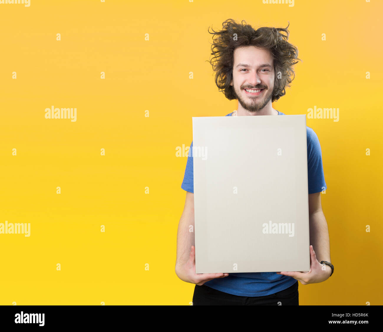 Bearded man with mustache and funny hair holding blank white board on ...