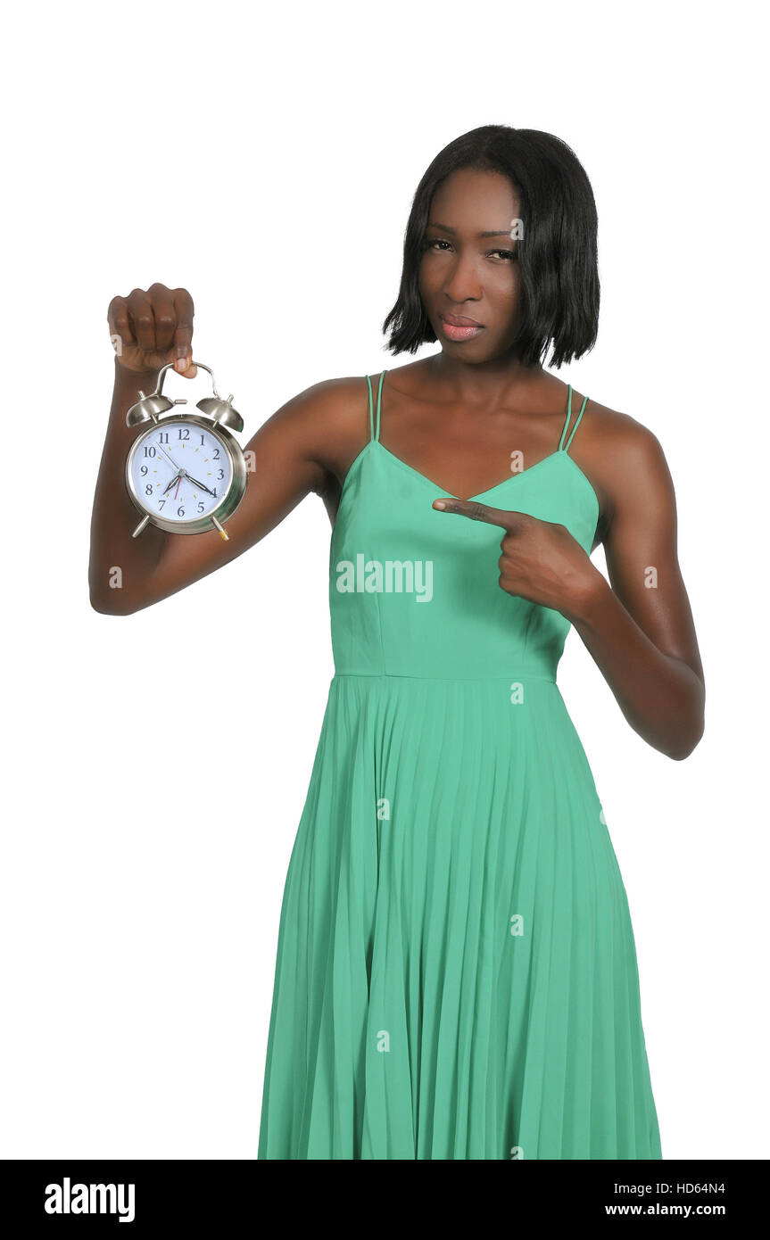 Woman counting the time on an alarm clock Stock Photo - Alamy
