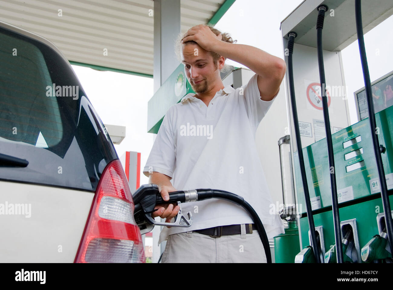 Man at a petrol station Stock Photo - Alamy