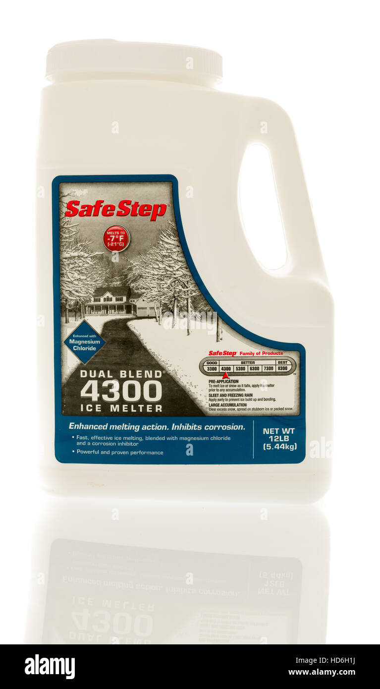 Winneconne, WI - 7 December 2016: Container of Safe Step ice melt salt on an isolated background ...