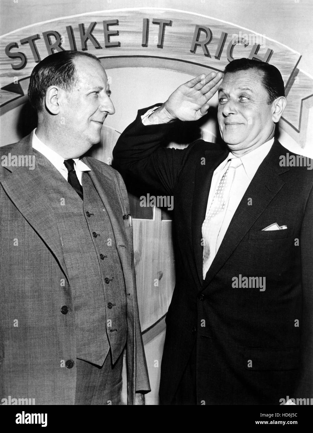 STRIKE IT RICH, game show host, Warren Hull, salutes guest actor, Paul ...