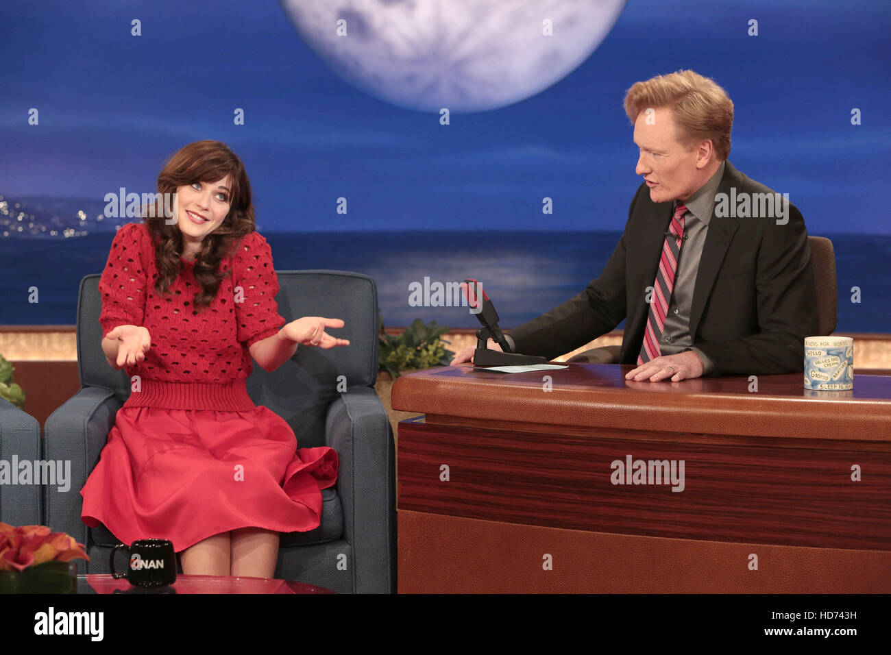 CONAN, (from left): Zooey Deschanel, host Conan O'Brien, (Season 4, aired Sept. 22, 2014). photo ...