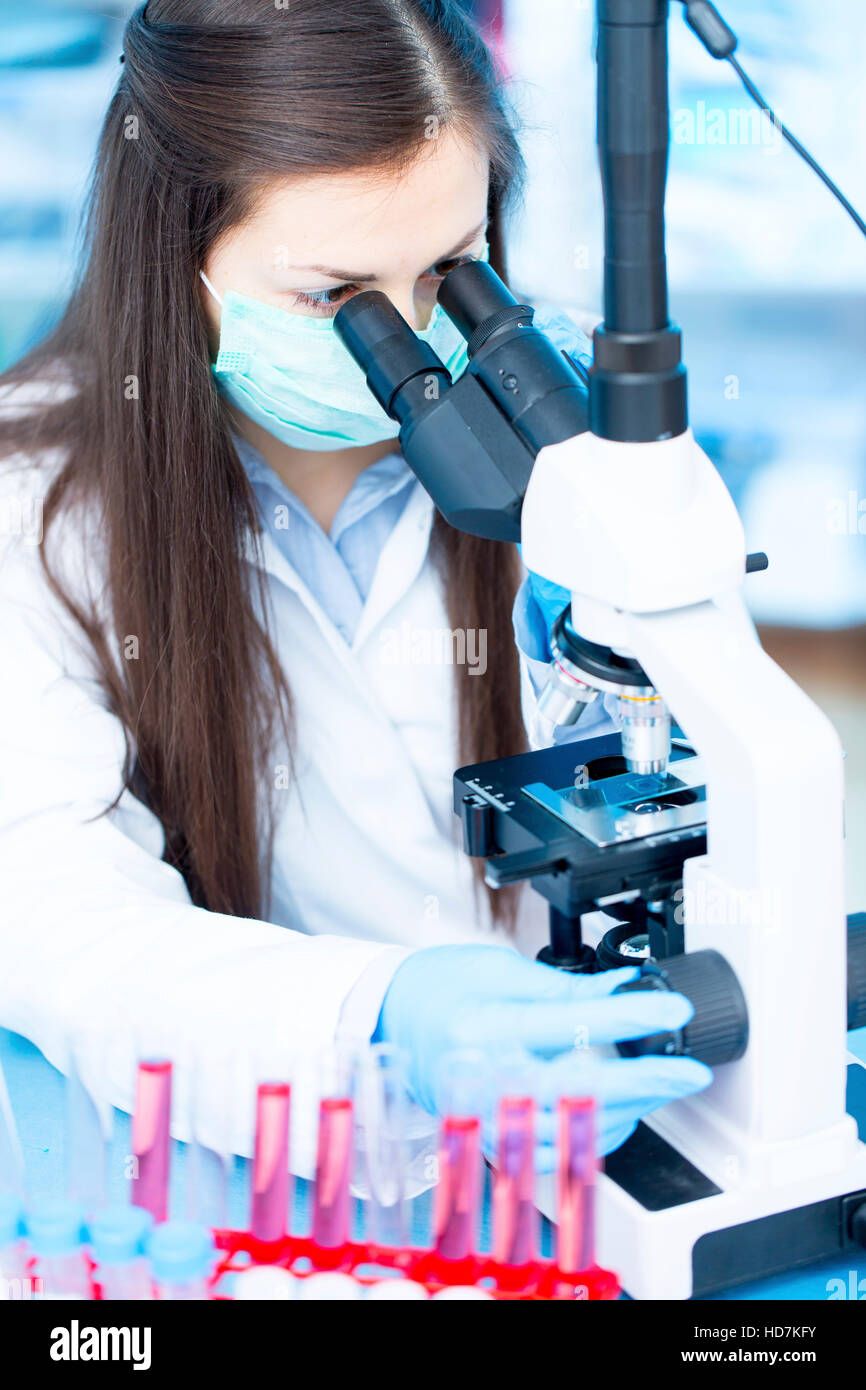 MODEL RELEASED. Girl using microscope Stock Photo - Alamy